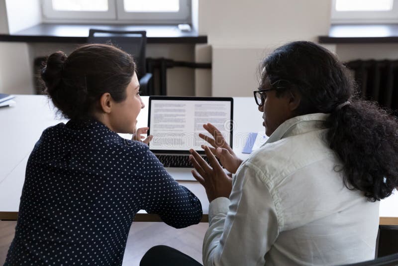 Two Indian Office Employees Sharing Laptop at Work Table Stock Photo ...
