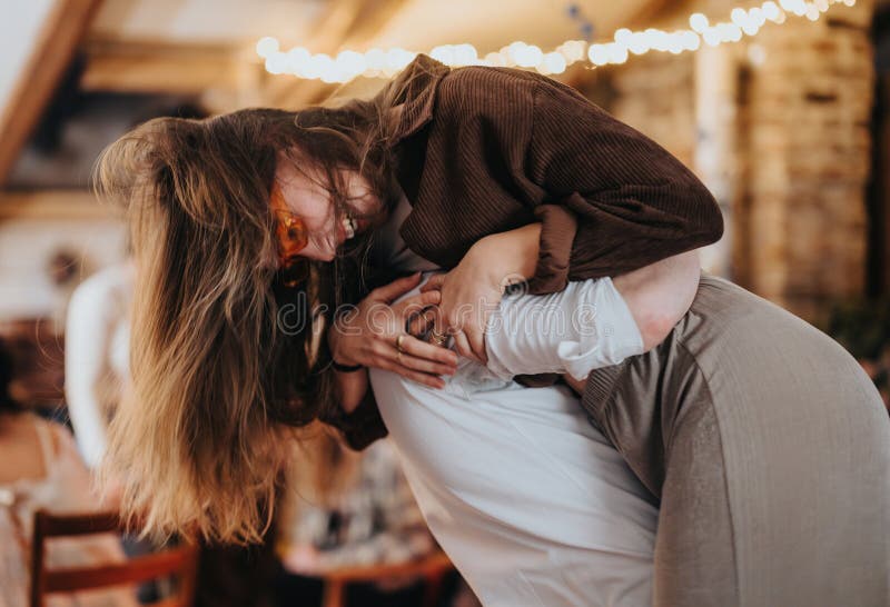 Joyful Moment of Friends Embracing in a Casual Indoor Setting Stock ...