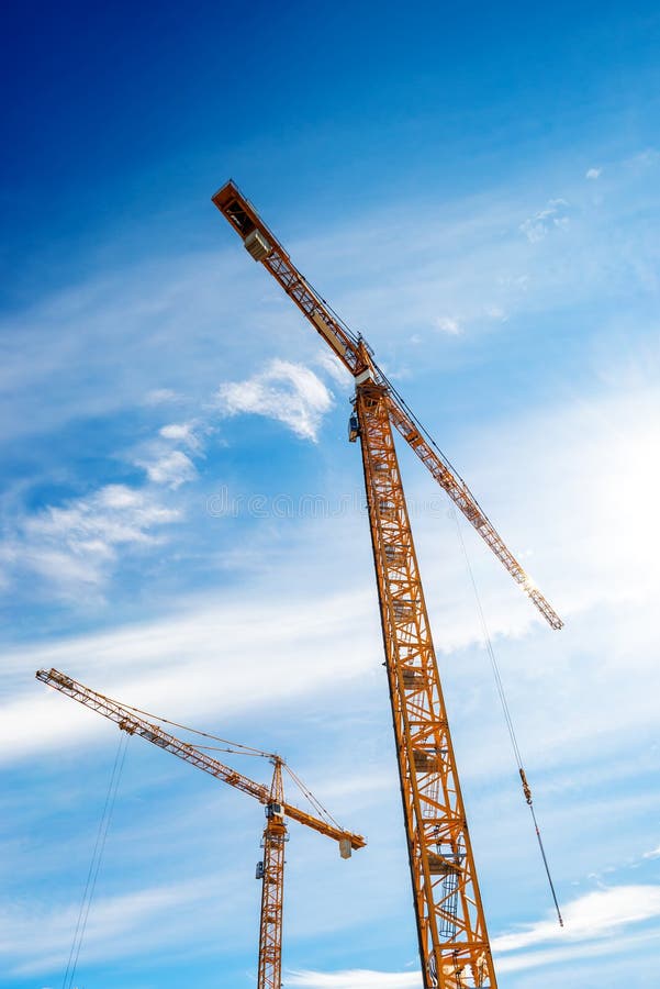 Two Industrial Cranes Working on Construction Site Stock Photo - Image ...