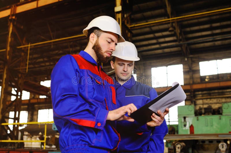 Two Workers Discuss a Construction Project Stock Image - Image of ...