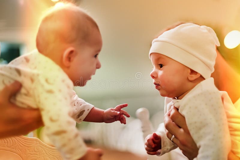 Two Infant Babies are Very Interested in Each Other. Learning Stock ...
