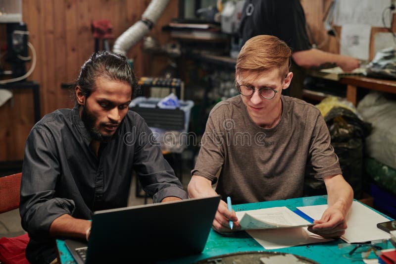 Two Intercultural Engineers with Laptop Stock Photo - Image of ...