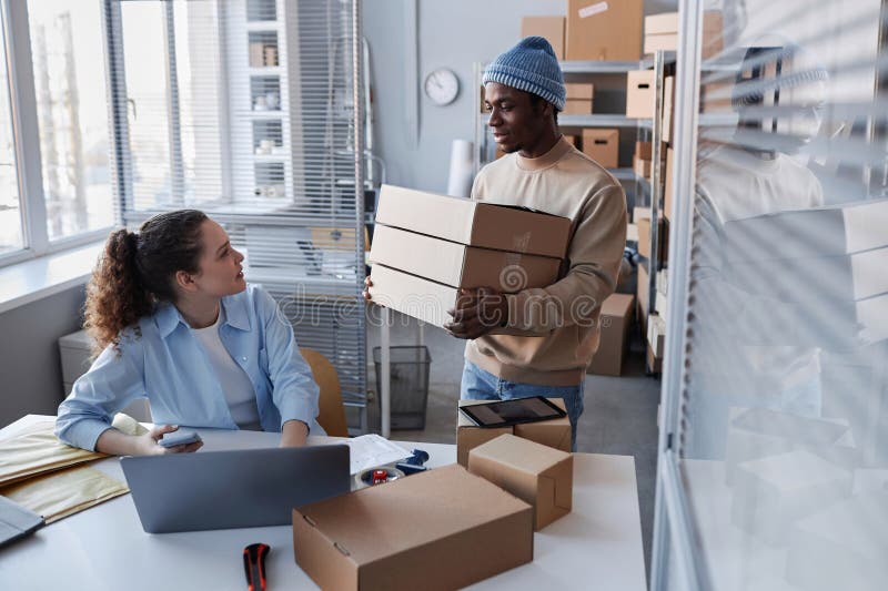 Two Intercultural Workers of Storage Room Communicating during Work ...