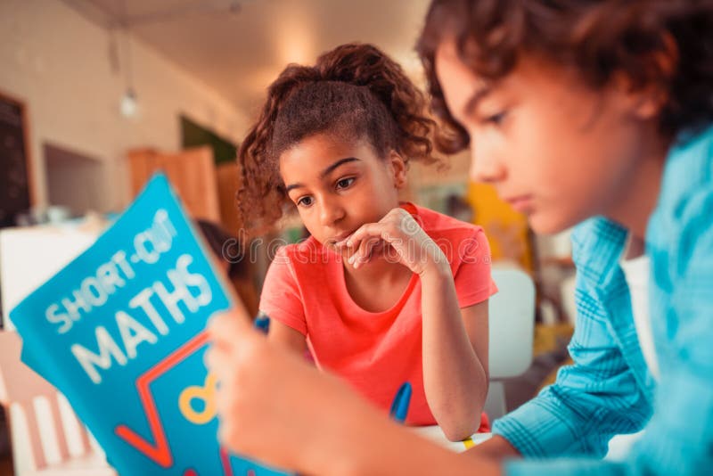 Two Interested Schoolchildren Reading a Math Textbook Stock Photo - Image of classroom ...