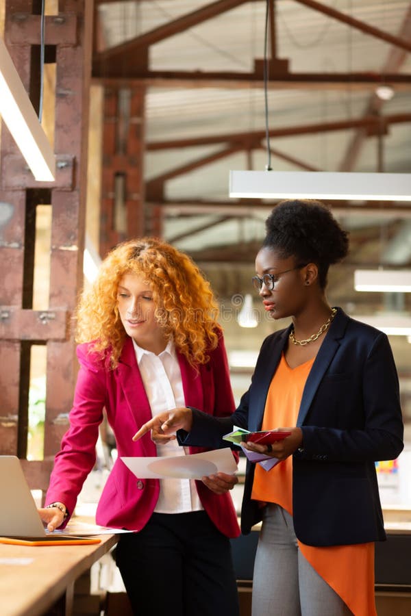 Two Interior Designers Using Laptop while Contacting Clients Stock ...