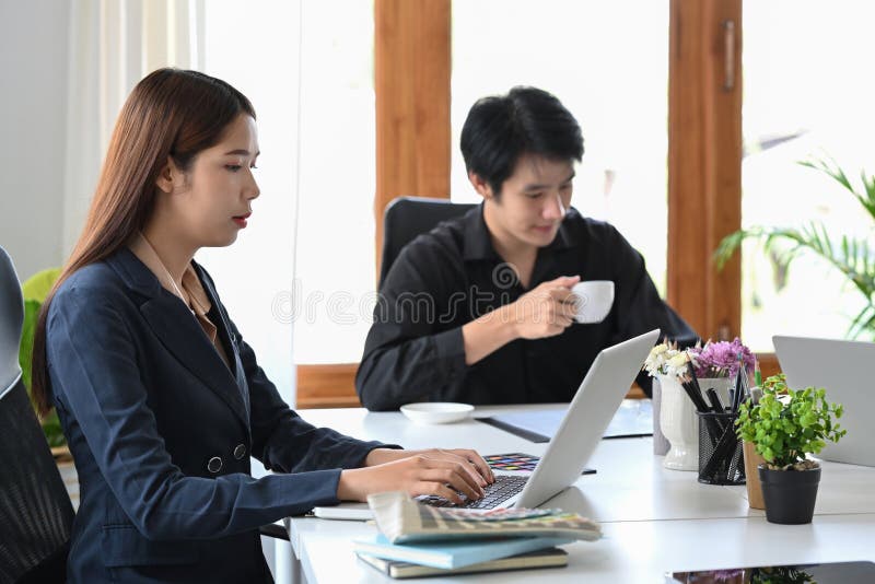 Two Interior Designers Working, Discussing New Project Plan Together ...