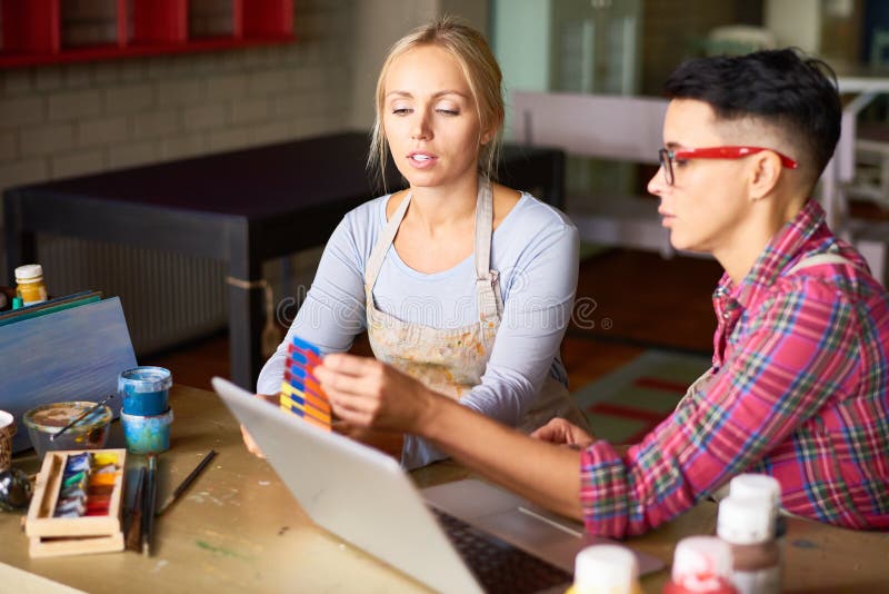 Two Interior Designers Working Together in Art Studio Stock Photo ...