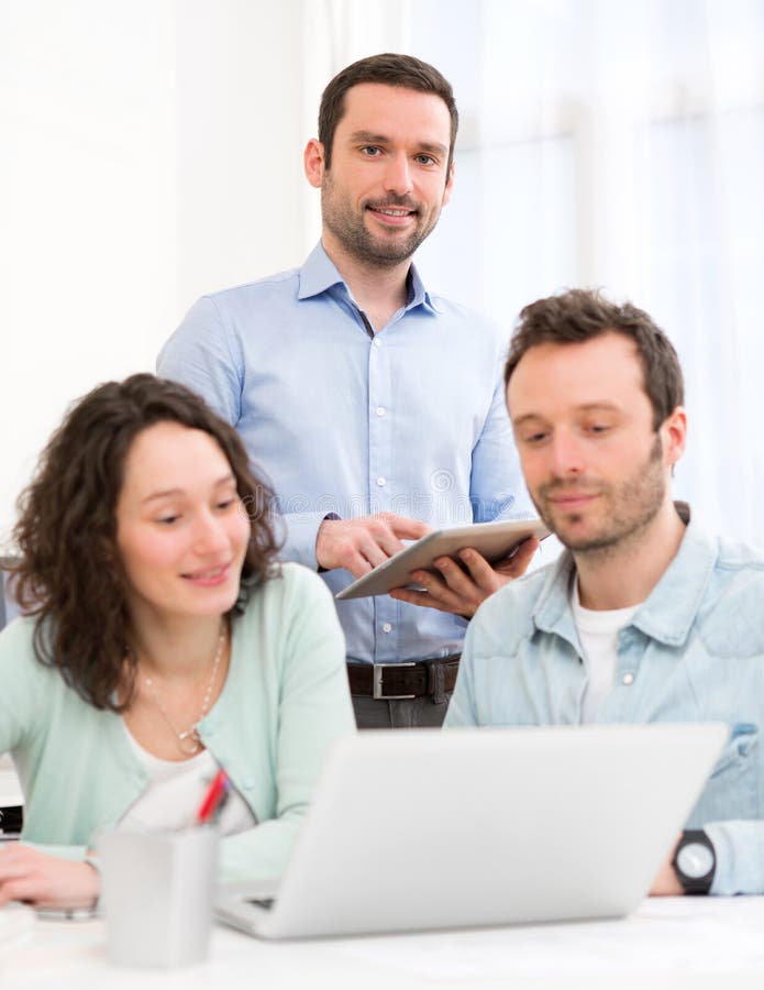 Two Interns Working Together Assisted by Their Course Supervisor Stock ...