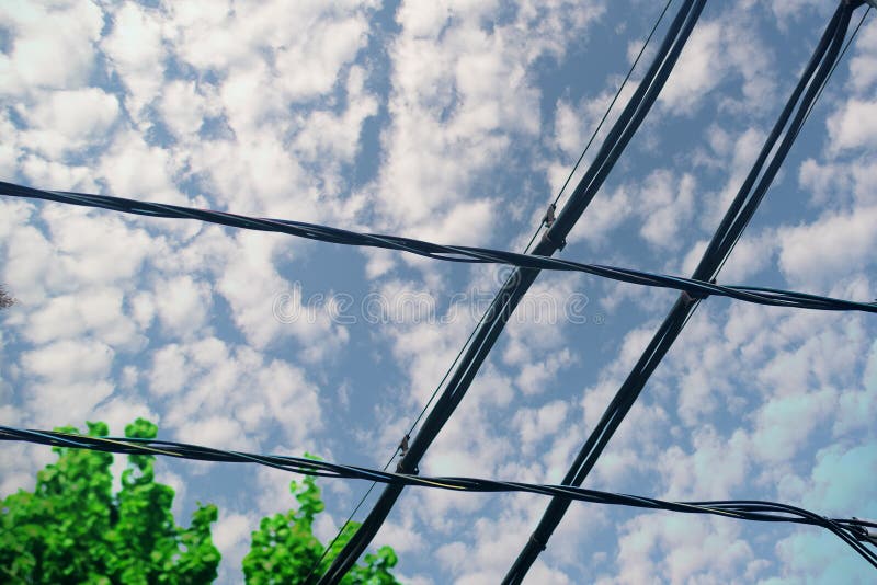 Two Intersecting Lines Wires Against a Blue Cloudy Sky Stock Image ...