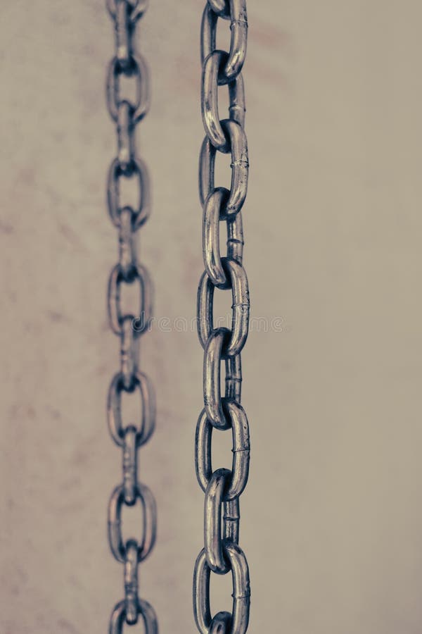 Two Iron Chains Hang Vertically on a Light Background Stock Image ...