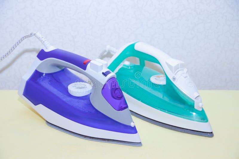 Two Irons on an Ironing Board. Selection and Comparison of Irons ...