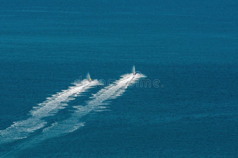 Two jet-skies riding stock photo. Image of holiday, overcast - 49112470