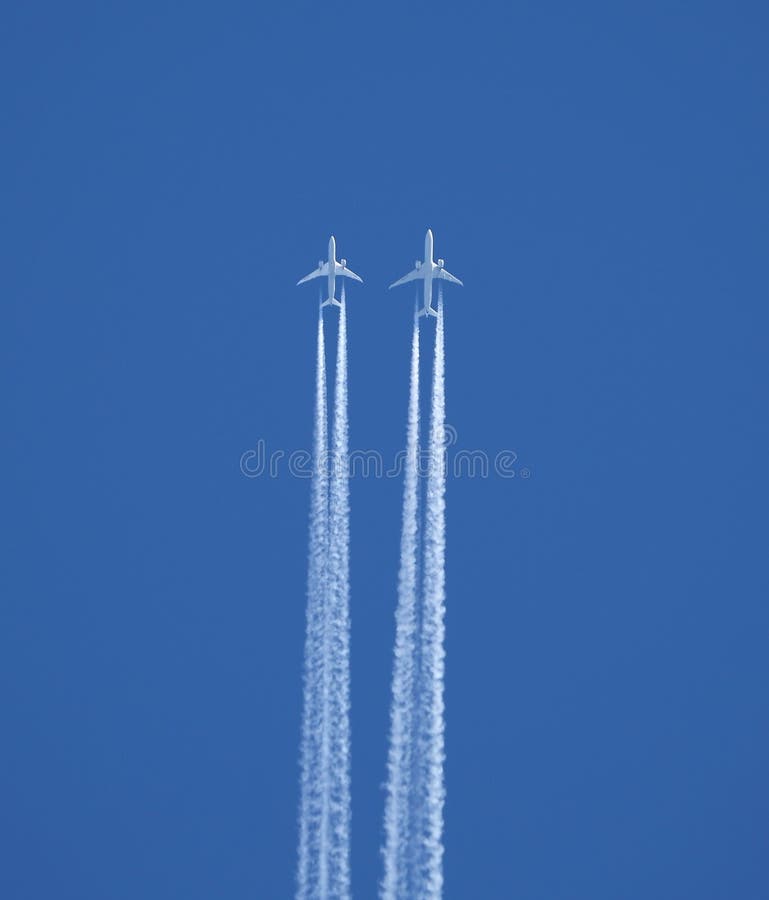 Two Jet Two-turbine Aircraft in Flight on Blue Sky Background Stock ...