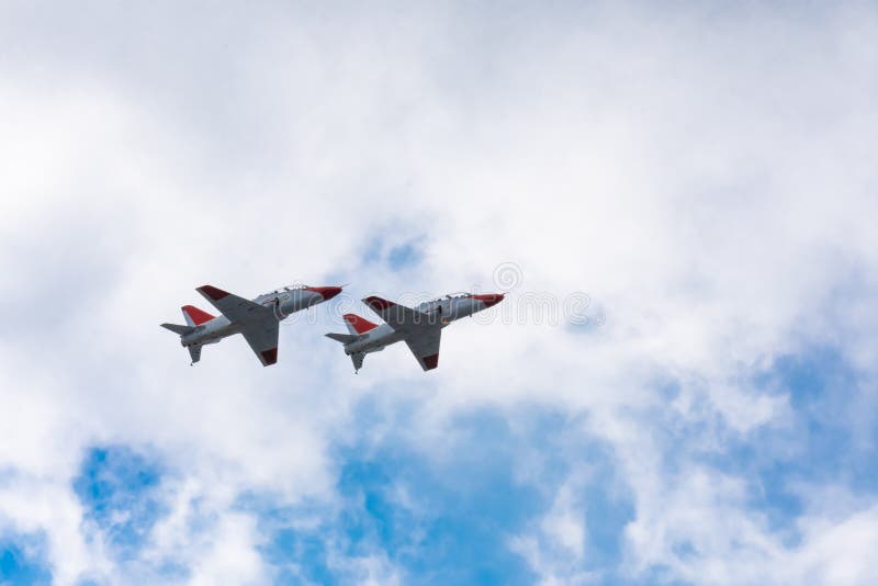 Two jets in cloudy sky editorial image. Image of fighter - 135048705