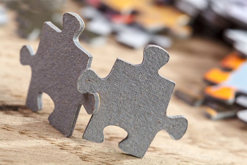 Two Jigsaw Puzzle Pieces on Table Stock Image - Image of problem ...