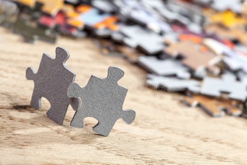 Two Jigsaw Puzzle Pieces on Table Stock Image - Image of join, solving ...