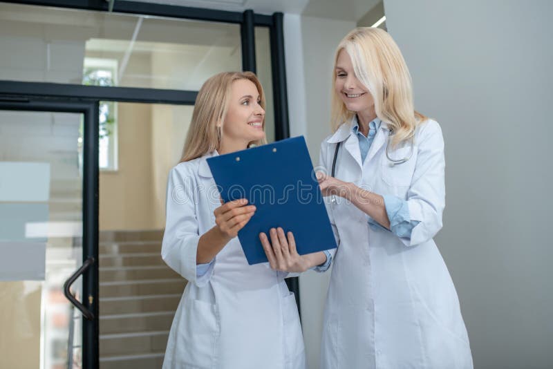 Two Joyful Colleagues Doctors Communicating on Work Issues Stock Photo ...