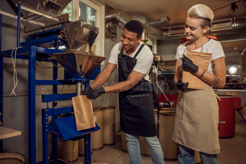 Two Joyous Coffee Roasters Involved in Work Stock Image - Image of ...