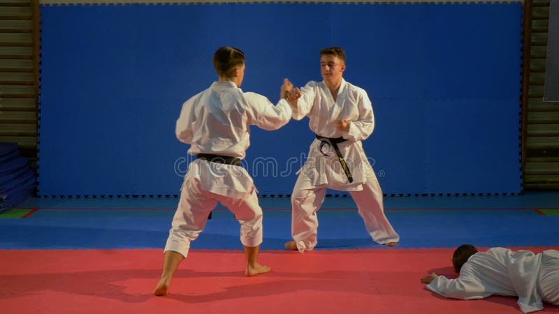 Man Karate Practitioner Sitting in Twine Position on the Floor while ...