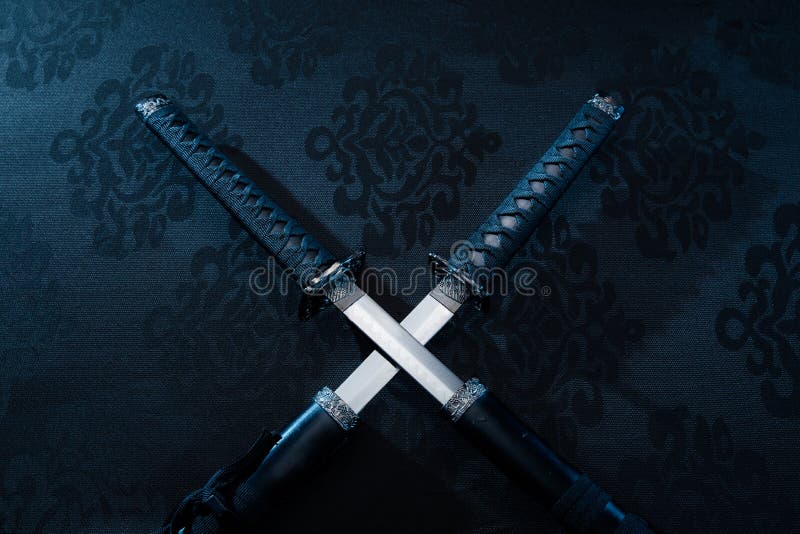 Two Katanas with Partially Drawn Blades on Fabric Stock Image - Image ...