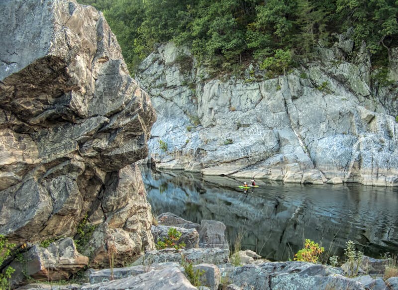 Two Kayakers on River by Cliffs Stock Photo - Image of river, kayakers ...