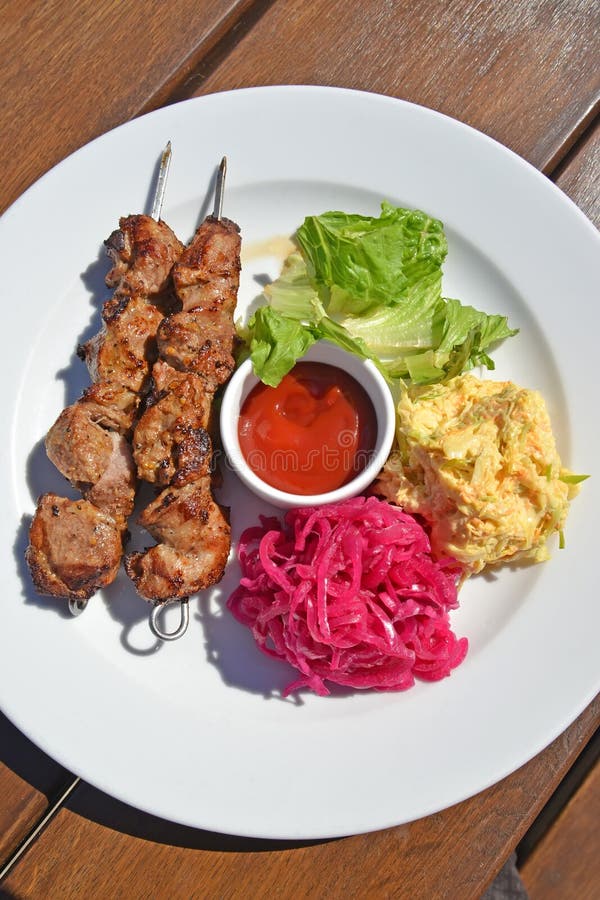Two Kebabs on Skewers with a Side Dish of Vegetable Salads Stock Image ...