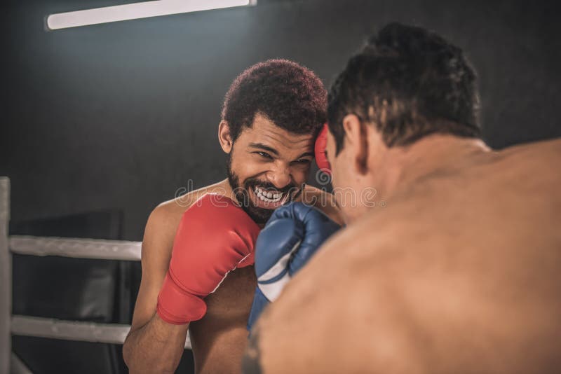 Two Kickboxers Fighting on a Boxing Ring and Looking Aggressive Stock ...