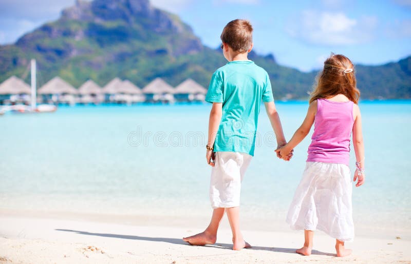Happy Kids on Pretty Beach stock photo. Image of child - 5336672