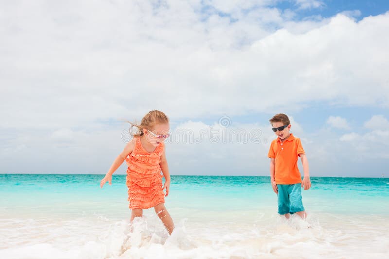 Kids at the beach stock image. Image of action, outdoor - 67266237