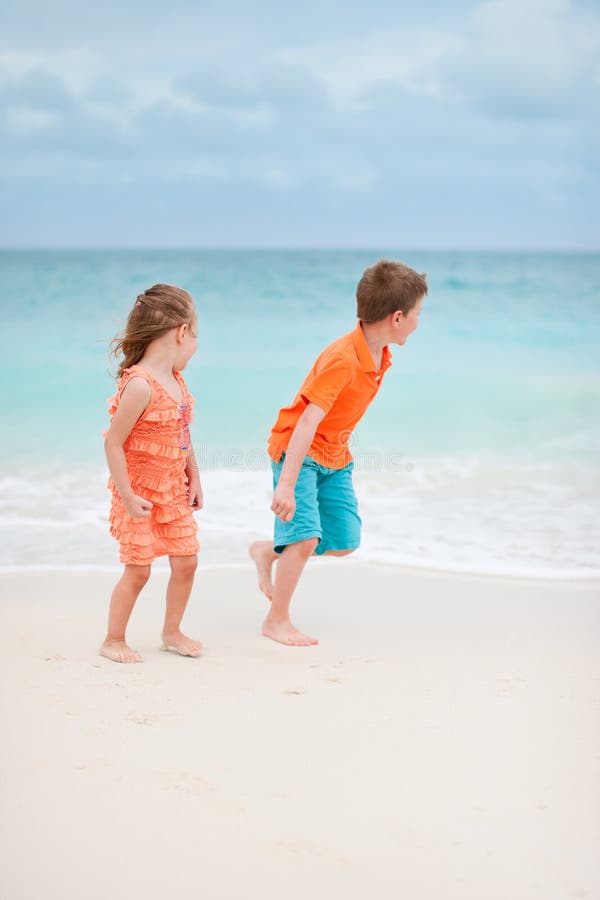 Two kids at beach stock photo. Image of exotic, lifestyle - 27374262