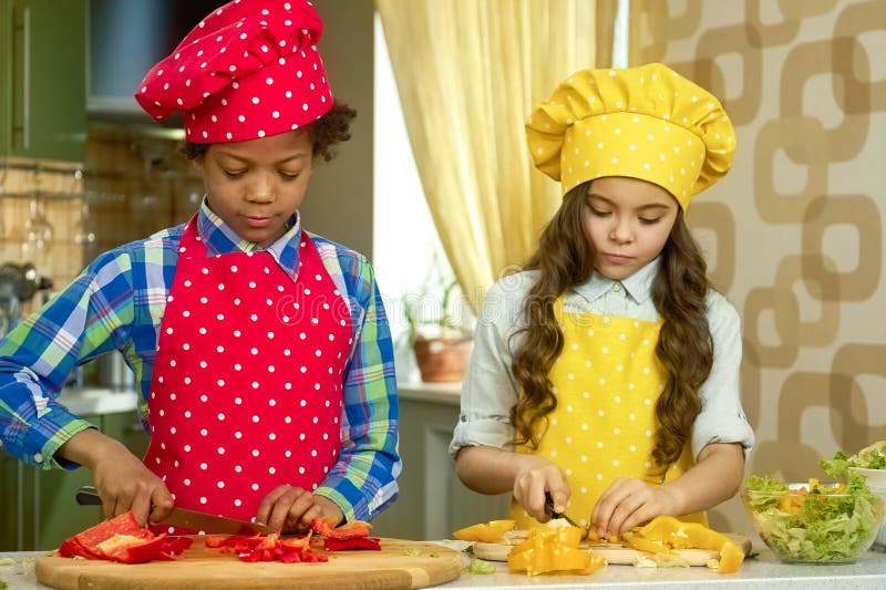 Two kids cooking. stock image. Image of girl, people - 111530237