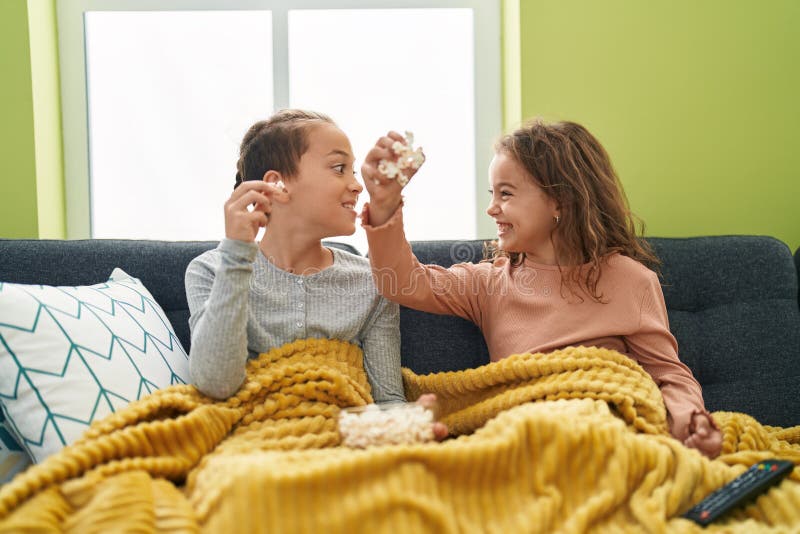 Two Kids Eating Popcorn Watching Movie at Home Stock Image - Image of ...