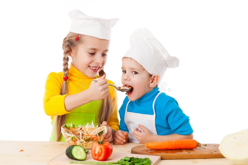 Two kids eating salad stock image. Image of childhood - 22789981