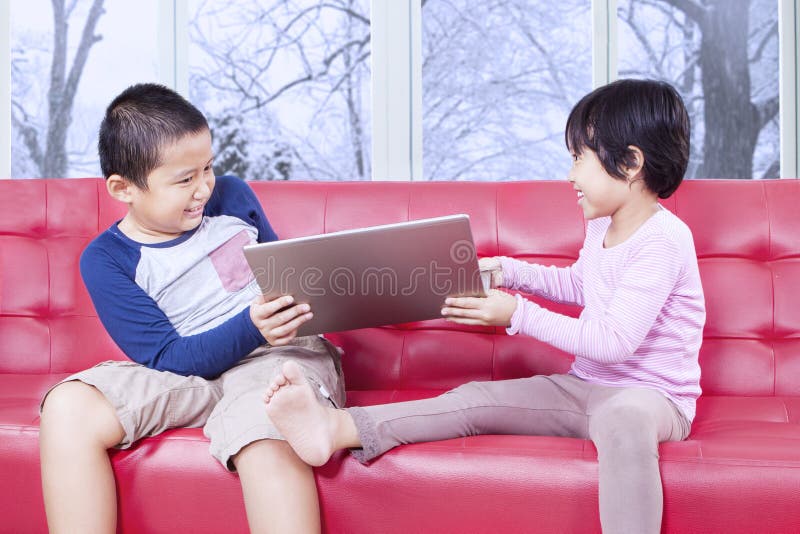 Two Kids Fighting To Take Over Laptop Stock Photo - Image of portrait ...