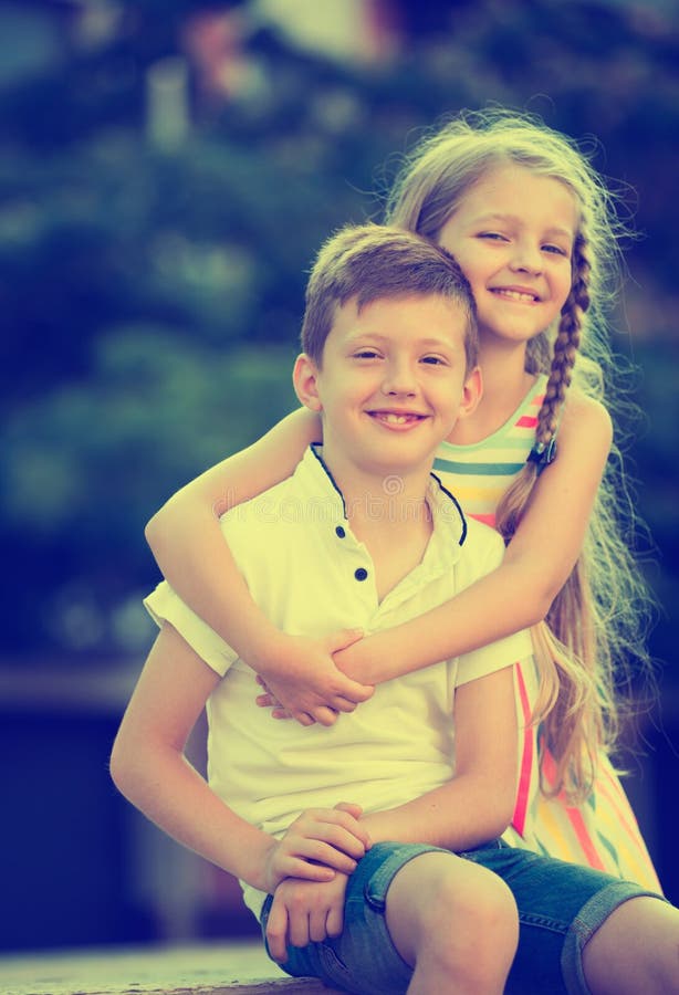Two kids hugs stock image. Image of holding, hugs, embracing - 91038637