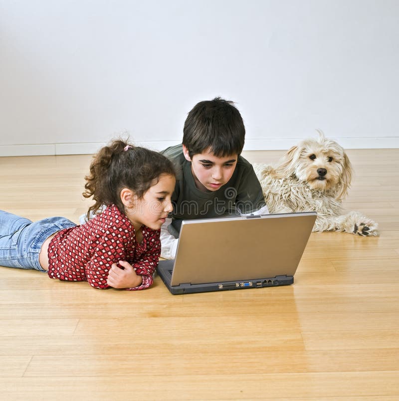 Two Kids with Laptop Computer and a Dog Stock Image - Image of ...
