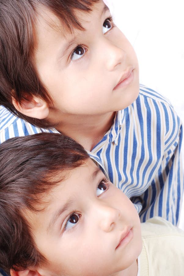 Two kids looking up stock photo. Image of gazing, close - 15738554