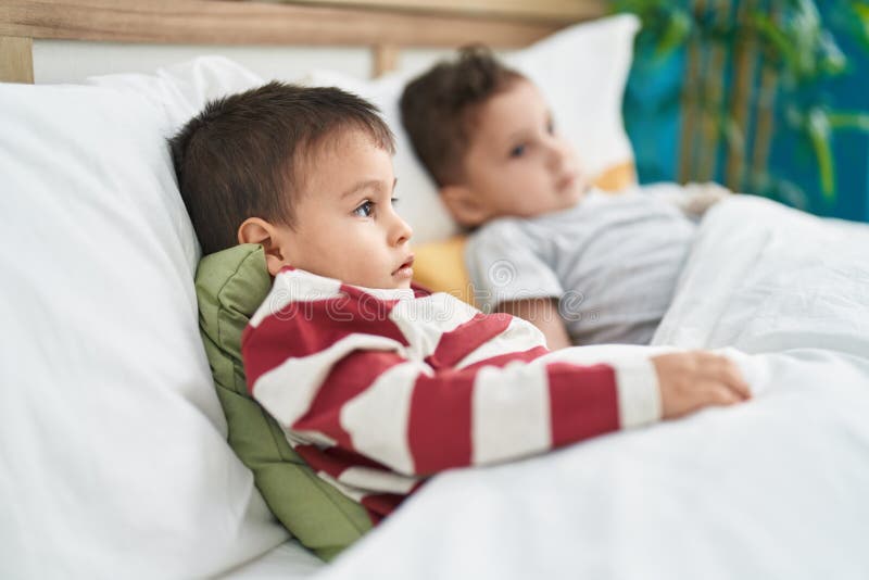 Two Kids Lying on Bed at Bedroom Stock Photo - Image of hispanic ...