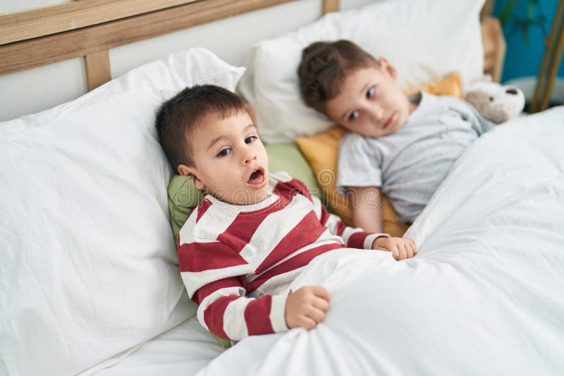 Two Kids Lying on Bed at Bedroom Stock Image - Image of pajamas ...