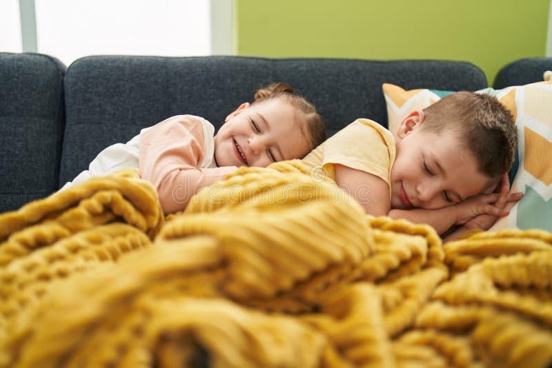 Two Kids Lying on Sofa Sleeping at Home Stock Image - Image of covering ...