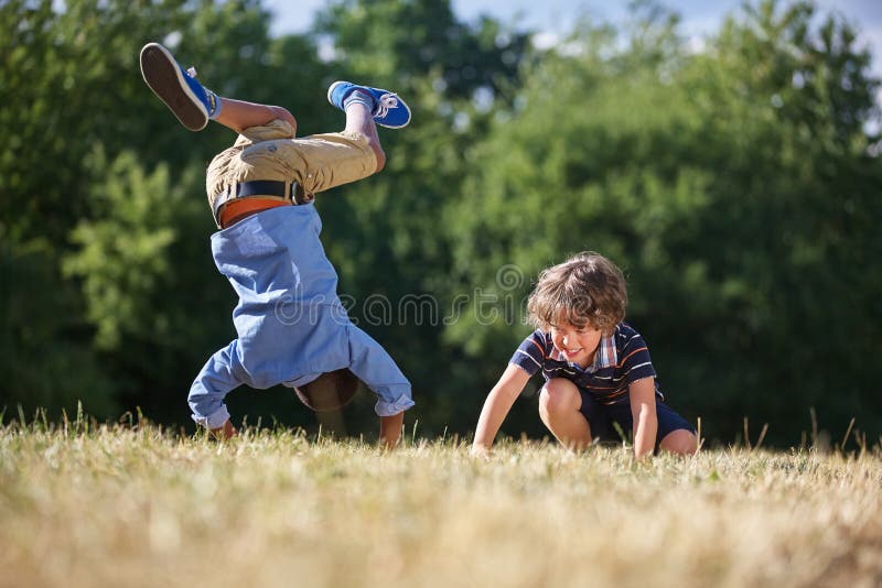 Two Kids Making a Somersault Stock Image - Image of leisure, movement ...