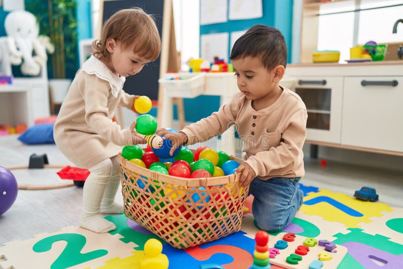 Two Kids Playing with Balls Standing at Kindergarten Stock Photo ...
