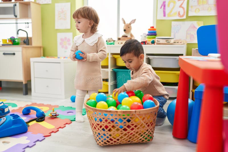 Two Kids Playing with Balls Standing at Kindergarten Stock Photo ...