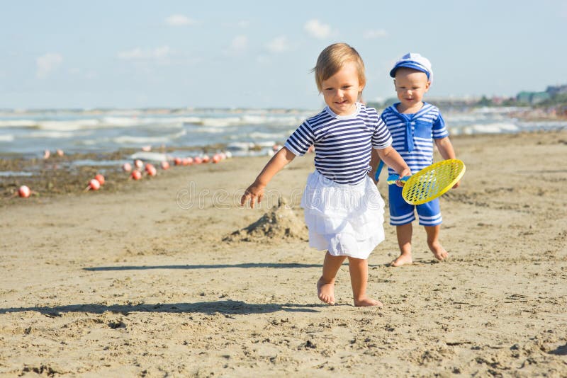 Two kids playing stock image. Image of sand, summer, play - 76355119