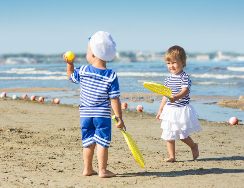 Kids Playing Beach Tennis Stock Photos - Free & Royalty-Free Stock ...