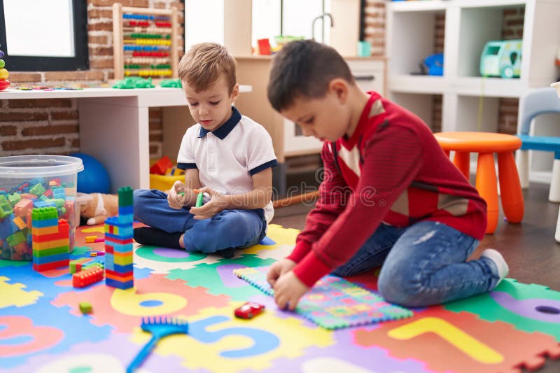 Two Kids Playing with Construction Blocks and Maths Puzzle Game Sitting ...