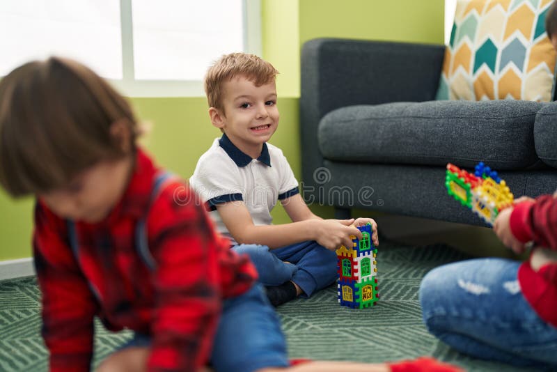 Two Kids Playing Construction Blocks Sitting on Floor at Home Stock ...