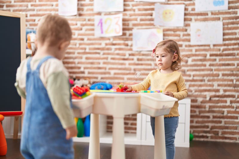 Two Kids Playing with Construction Blocks Standing at Kindergarten ...