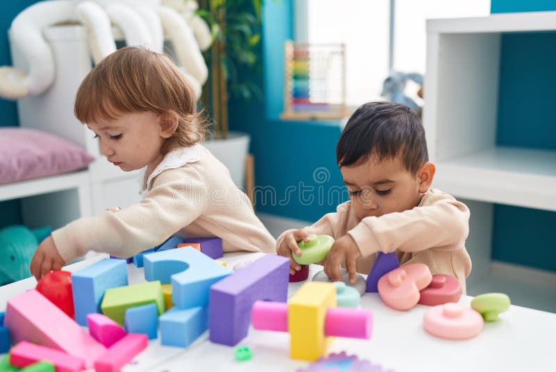 Two Kids Playing with Construction Blocks Standing at Kindergarten ...