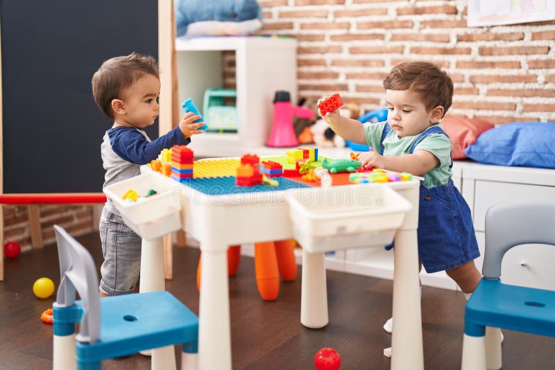 Two Kids Playing with Construction Blocks Standing at Kindergarten ...